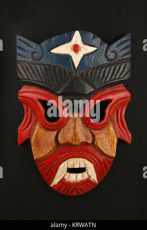a traditional thai demon wooden mask on sale as a souvenir in the Stock ...
