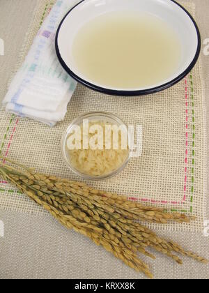 Rice water bath additive in a wash bowl Stock Photo - Alamy