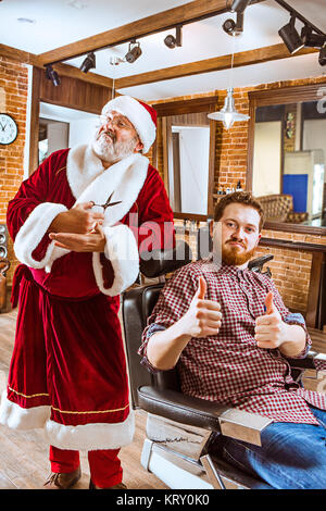 Santa claus as master at barber shop Stock Photo - Alamy