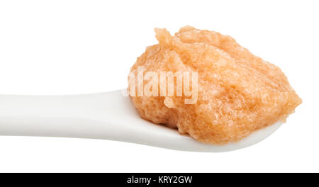 salty caviar of saffron cod in ceramic spoon isolated on white ...