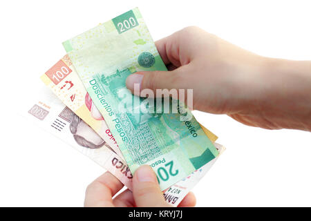 Hands counting Mexican pesos bills of different denominations, with ...