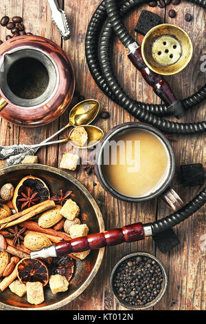 aroma Arab hookah with coffee in vintage style Stock Photo - Alamy