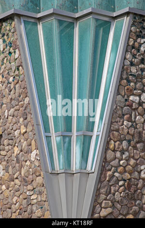 Architectural glass structure with a geometric triangular pattern on a ...