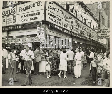 This photograph captures a crowd gathered in front of the U.S. Capitol ...