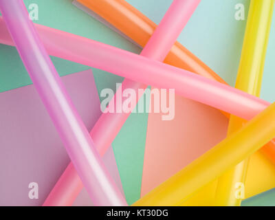colorful abstract composition of long balloons on shapes of color paper ...
