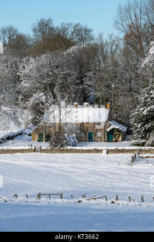 Turkdean village in the snow with blue sky in December. Lower Dean ...