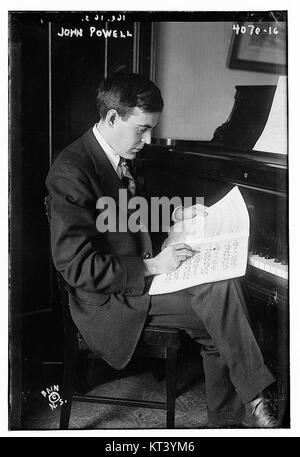 John Powell, a renowned composer, is captured playing the piano. This ...
