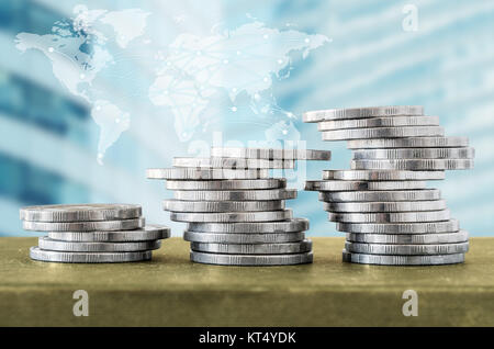 Coin stacks on world map surface. Banknotes and coins. World finance ...