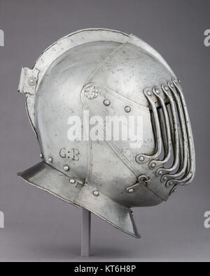This image shows an armet, a type of medieval armor worn by knights ...
