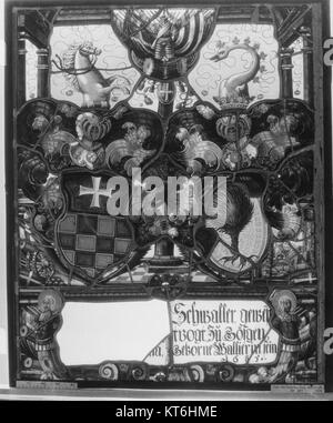 This armorial panel features heraldic designs, likely representing a ...