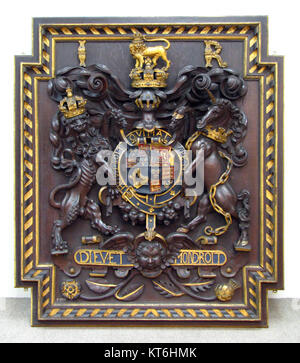 An armorial panel featuring heraldic symbols or coats of arms ...