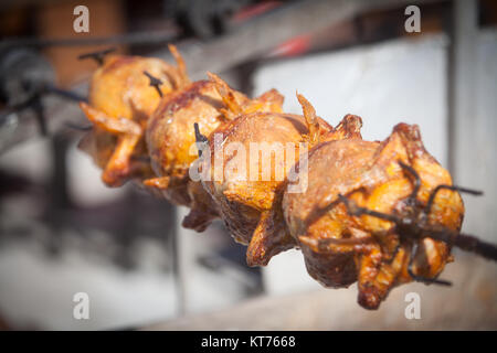 Grilled chicken on rotating machine Stock Photo - Alamy