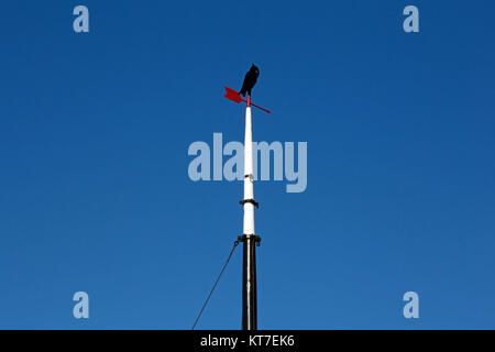 mast with stylized bird and wind vane Stock Photo - Alamy