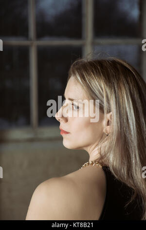 Scared woman looking over shoulder Stock Photo: 104821503 - Alamy