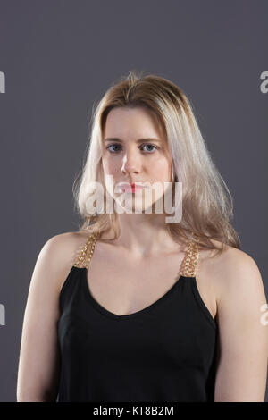 Beautiful blonde girl wearing black gymnastic bodysuit covered with ...