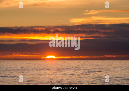 West Bay, Dorset, UK. 22nd December 2017. UK Weather. A dramatic sunset ...