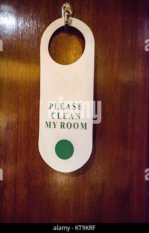 please clean my room hotel tag hanging on door knob Stock Photo - Alamy