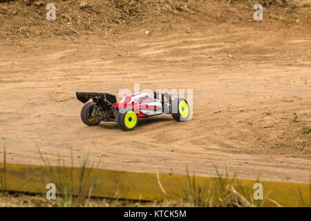 Radio controlled car model in race on dirt track Stock Photo - Alamy