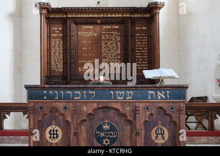 The ten commandments in Hebrew inscribed over a wooden Torah Ark closet ...