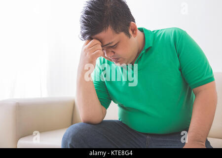 overweight man depress thinking about his weight problem Stock Photo ...