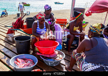 Women cleaning fish on the local market of the city Marigot on the ...