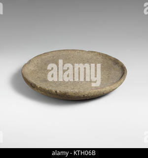 This basalt mortar or plate, cataloged in the Metropolitan Museum of ...