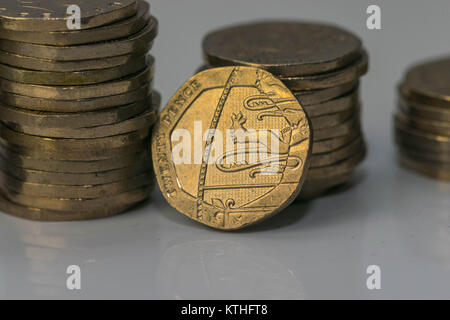 Stacks of different British coins on a white background Stock Photo - Alamy