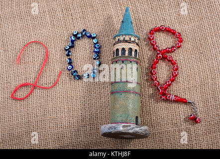 Happy Year 2018 with spool, Galata Tower and beads Stock Photo - Alamy