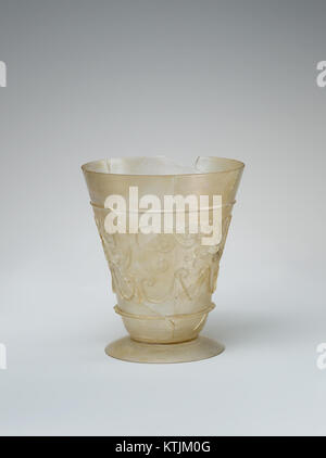 This beaker, featuring relief cut decoration, is an example of ...