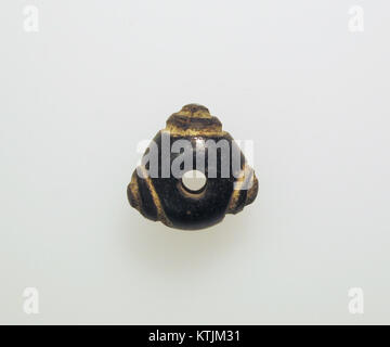 This bead, cataloged in the MET collection, demonstrates ancient ...