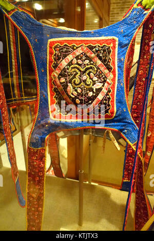 This baby carrier, displayed at the Hong Kong Museum of History, is a ...