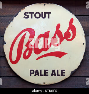 This enamel advertising sign promotes Bass Stout Pale Ale, showcasing ...