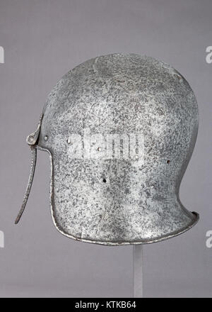 This barbute helmet, featuring a hinged nasal guard, is a type of ...