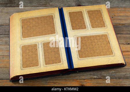 Vintage photo album on wooden background hand made Stock Photo - Alamy