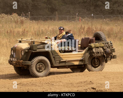 This image features an Austin Champ, a British military vehicle, with a ...
