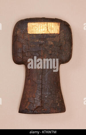 An ancient Egyptian artifact depicting the goddess Bastet, shown with a ...