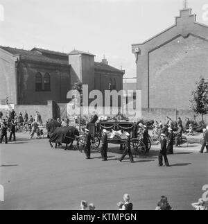 This photograph depicts the funeral of an individual from the Adu ...