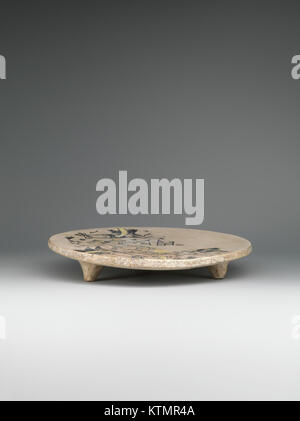 This base is from a footed buff ware vessel, known for its ...