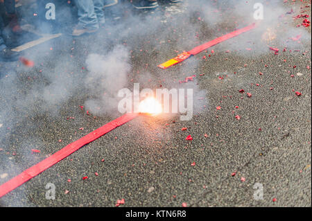 Firecrackers exploding at the Chinese New Year parade in the streets of ...