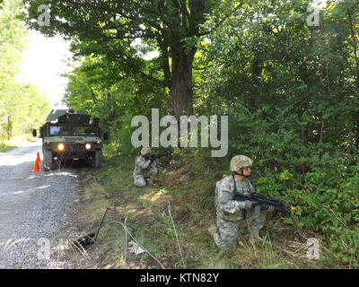 Signal Soldiers of the 369th Sustainment Brigade practice aligning a ...