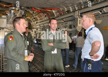(From left) Cpt. Ryan Daughtery, Col. Thomas McEntee, C-17 pilot and ...