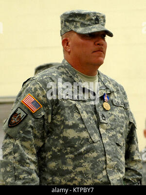 SYRACUSE, NY--Capt. Timothy Neild, seated left watches awards ceremony ...