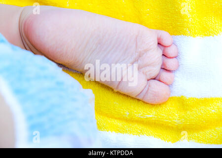 Little wrinkled baby feet of a newborn child photographed about 15 ...