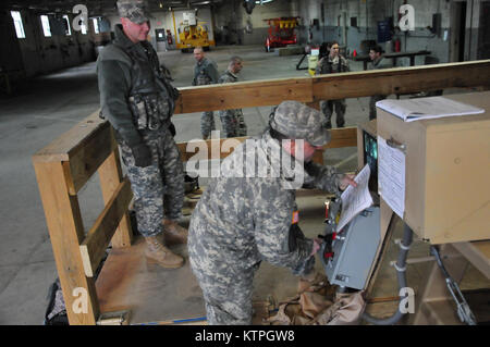 Sgt. 1st Class Nicholas Pardi, 42nd Infantry Division, conducts a ...