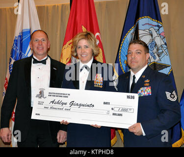 Family members of Chief Master Sgt. Marvin Boyd stand for the playing ...