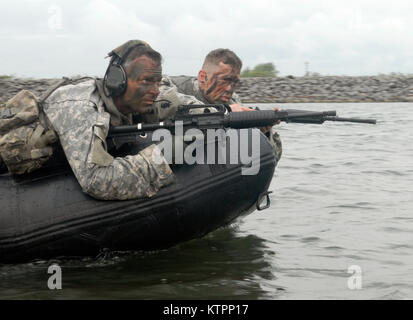 Infantrymen with the 1st Squadron, 2nd Cavalry Regiment fire a Stryker ...