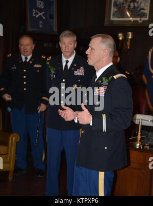 Lt. Col. Sean Flynn, commander of the 1st Battalion, 69th Infantry, accepts the regimental ...