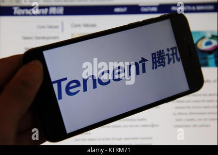 In this photo illustration, the Tencent logo is displayed on a ...