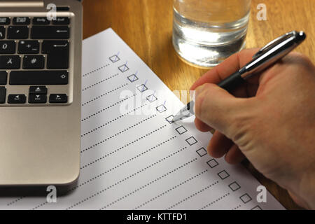 checklist being completed Stock Photo - Alamy