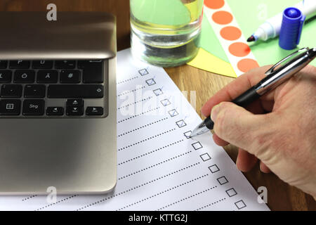 checklist being completed Stock Photo - Alamy